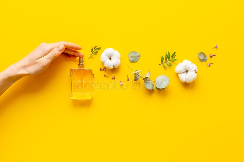 Female Hand Spray Perfume Bottle and Flow of Flowers Stock Image ...