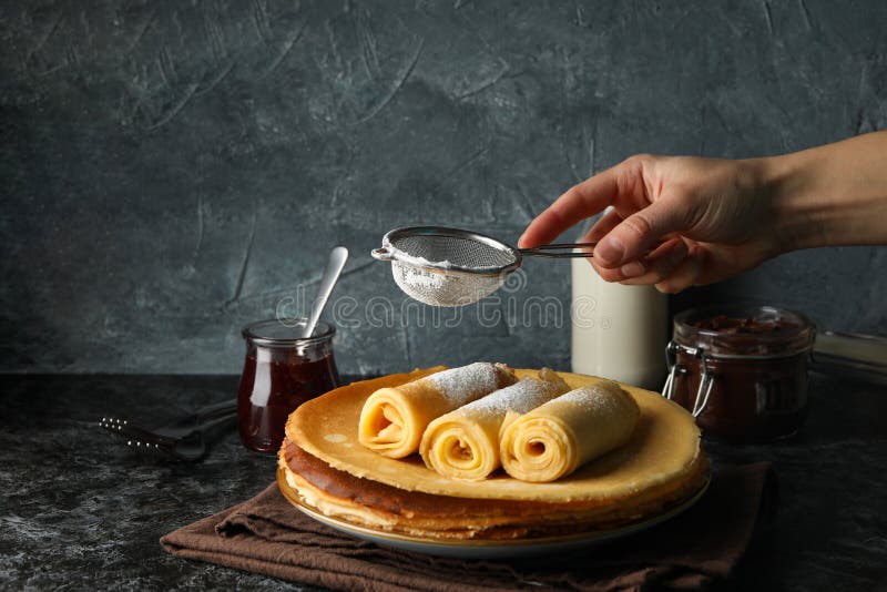 Female Hand Sprinkle Sugar Powder on Crepe Rolls Stock Image - Image of ...