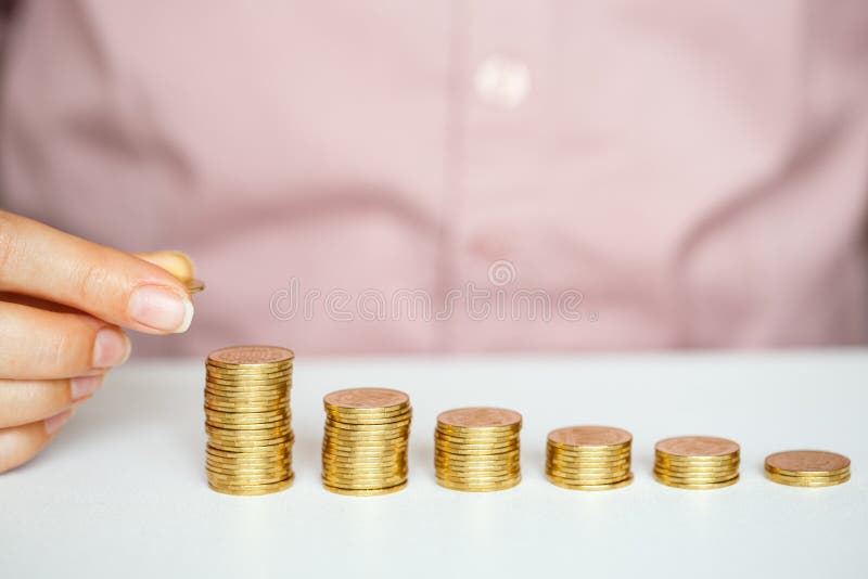 Female Hand Stacking Gold Coins into Increasing Columns Stock Image ...