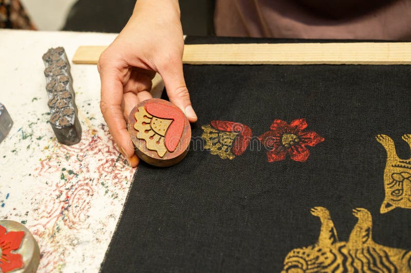 Female Hand Stamping Textiles with Colorful Patterns and Designs Stock ...