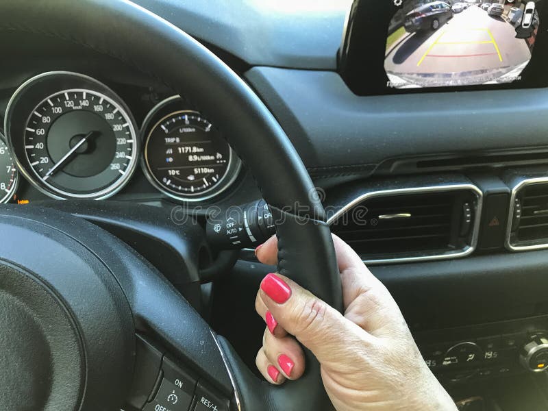 Female Hand on the Steering Wheel Inside the Car. Stock Photo - Image ...