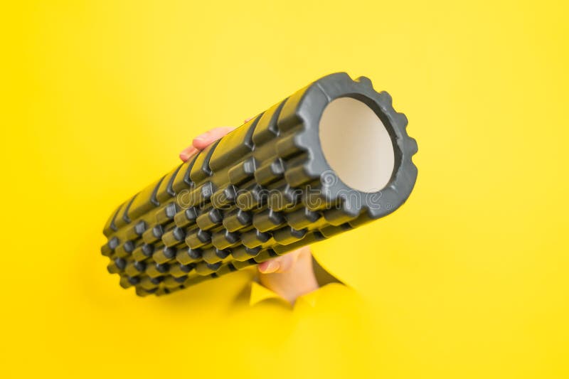 Female Hand Sticking Out Mfr Roller Yellow Paper Background Stock ...