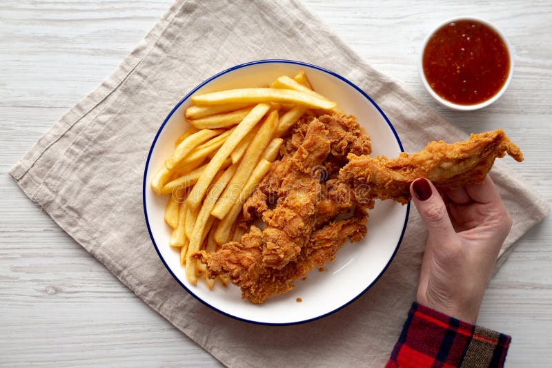 Female Hand Takes Crispy Chicken Strips, Top View Stock Image - Image ...