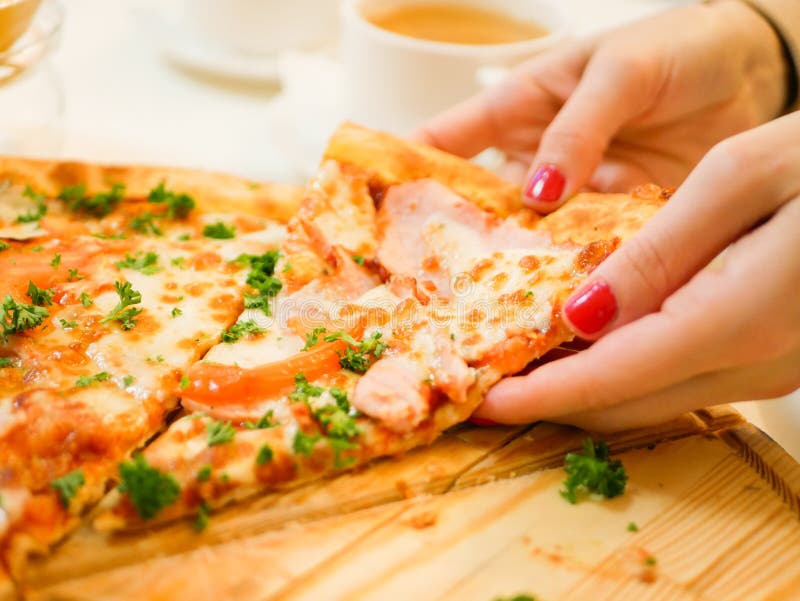 Female Hand Takes Pizza. Kind of Pizza with Bacon, Tomatoes and Herbs ...