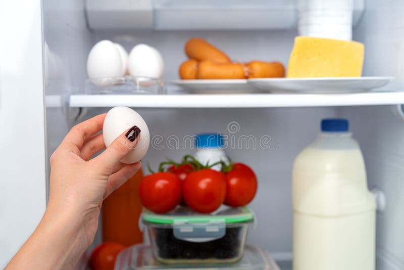 Female Hand Taking Egg from a Fridge Stock Image - Image of organic ...