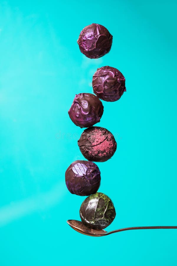 Female Hand Throwing Bright Multi-colored Round Candies into Air ...