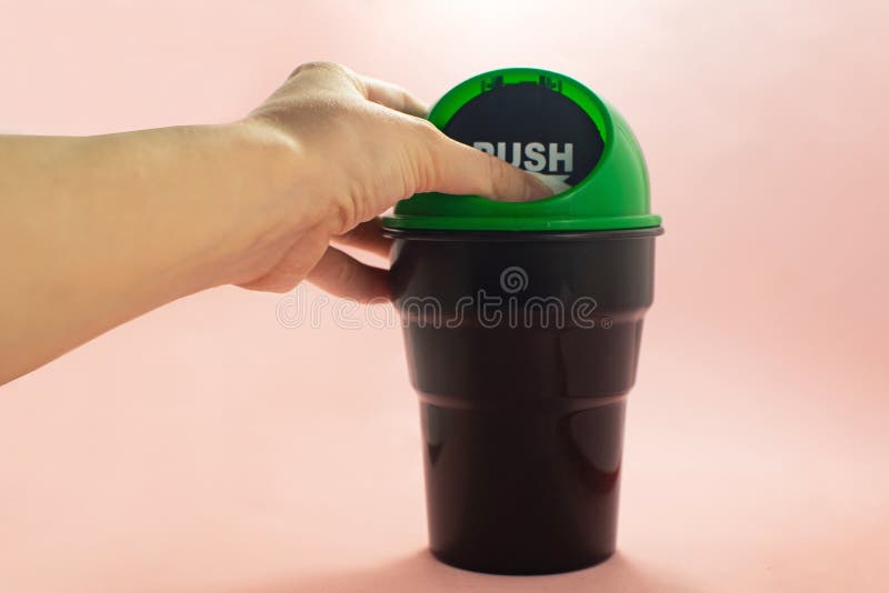 Female Hand Throws Trash into the Container. Trash Recycling Container ...