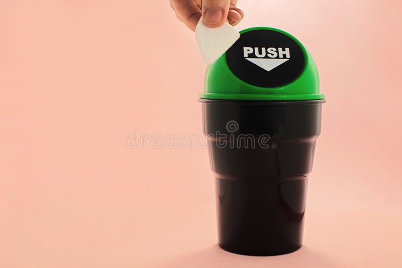 Female Hand Throws Trash into the Container. Trash Recycling Container ...