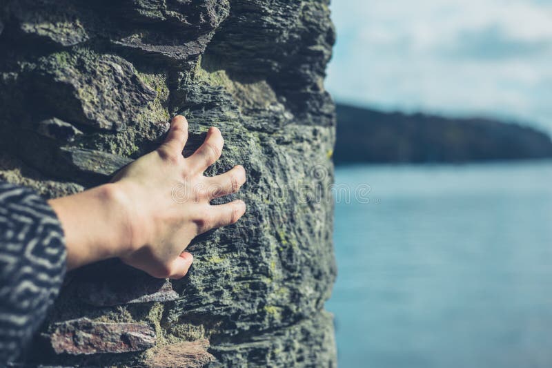 Female Hand Touching Rock by the Sea Stock Image - Image of cliff ...