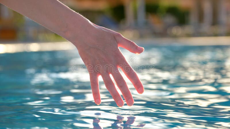 Female Hand Touching Water of Swimming Pool in Summer Stock Photo ...