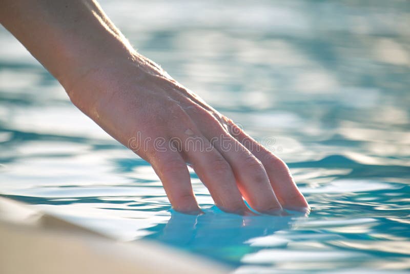 Female Hand Touching Water of Swimming Pool in Summer Stock Photo ...