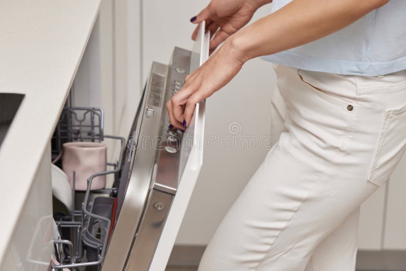 Female Hand Turning on Dishwasher Machine in Kitchen Stock Image ...