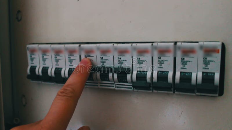 The Female Hand Turns on and Off the Toggle Switch on the Electrical ...