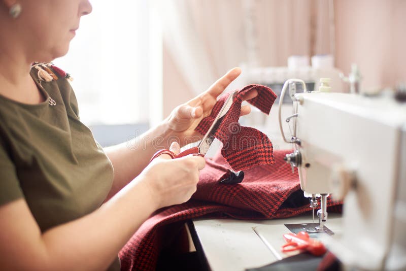 Working Female Hands Using Scissors for Cutting Off Plaid Fabric in ...
