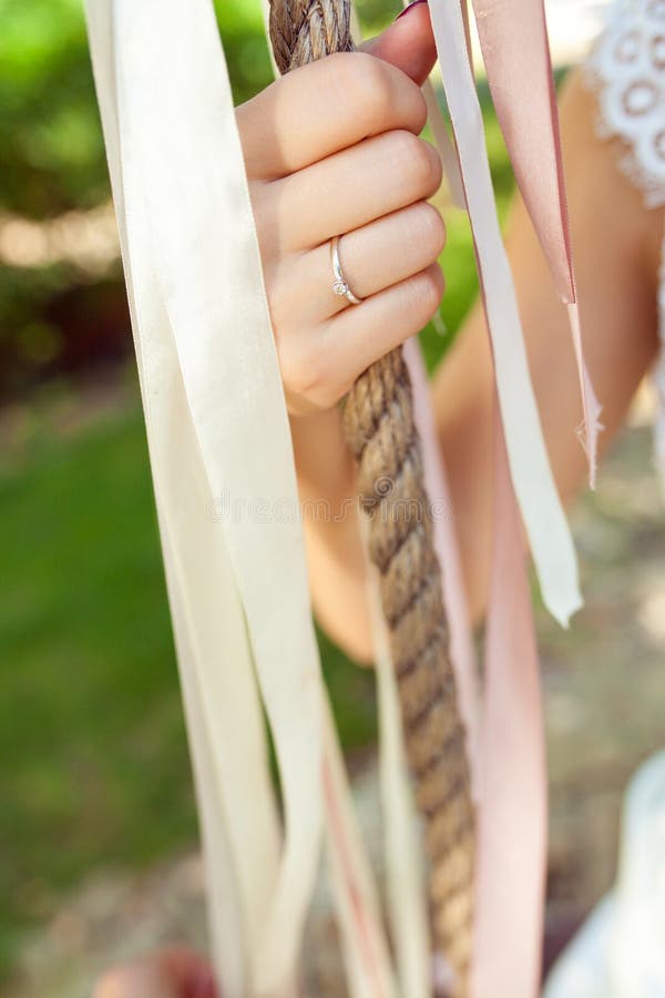 Female Hand with Wedding Ring Holding Rope Stock Photo - Image of ...