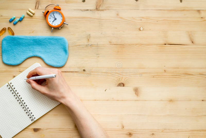 Female Hand Write in Notebook - Day Plan before Sleeping. Top View ...