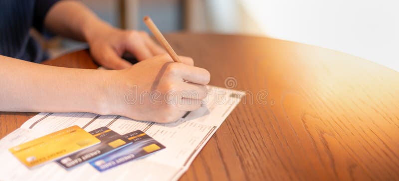 The Female Hand Writing on the Blank Credit Application Form for ...