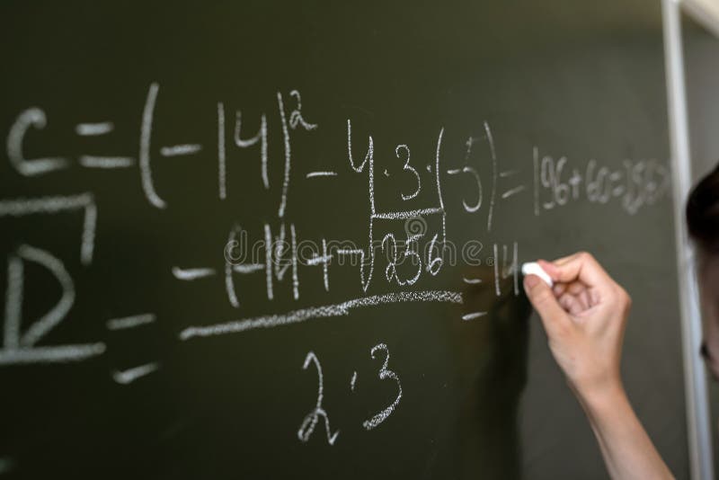 Female Hand Writing Math Formulas on the Classboard Stock Image - Image ...