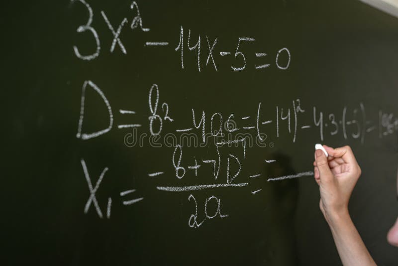 Female Hand Writing Math Formulas on the Classboard Stock Image - Image ...