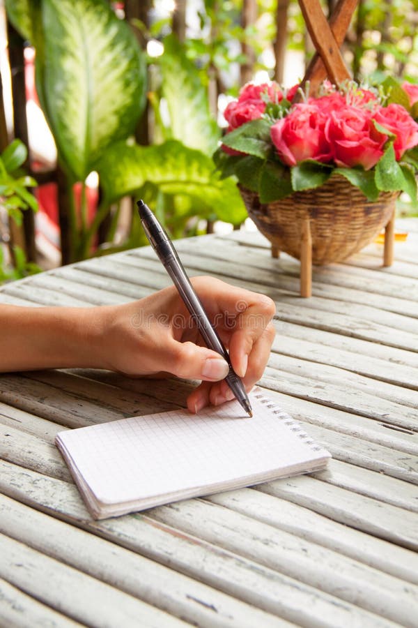 Female Hand Writing in a Notebook on Wooden Table Stock Photo - Image ...