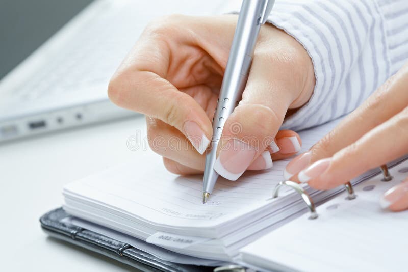 Close Up of a Woman Hand Writing on a Notebook Outdoor Stock Image ...