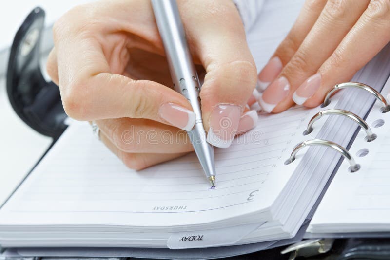 Female hand writing notes stock image. Image of color - 10812775