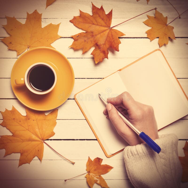 Female Hand Writing Something in Notebook Near Cup of Coffee. Stock ...