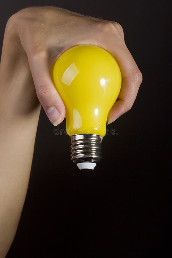 Hand with light bulb stock photo. Image of bulb, yellow - 153602938