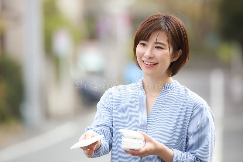 Female handing out tissue stock photo. Image of people - 238946228