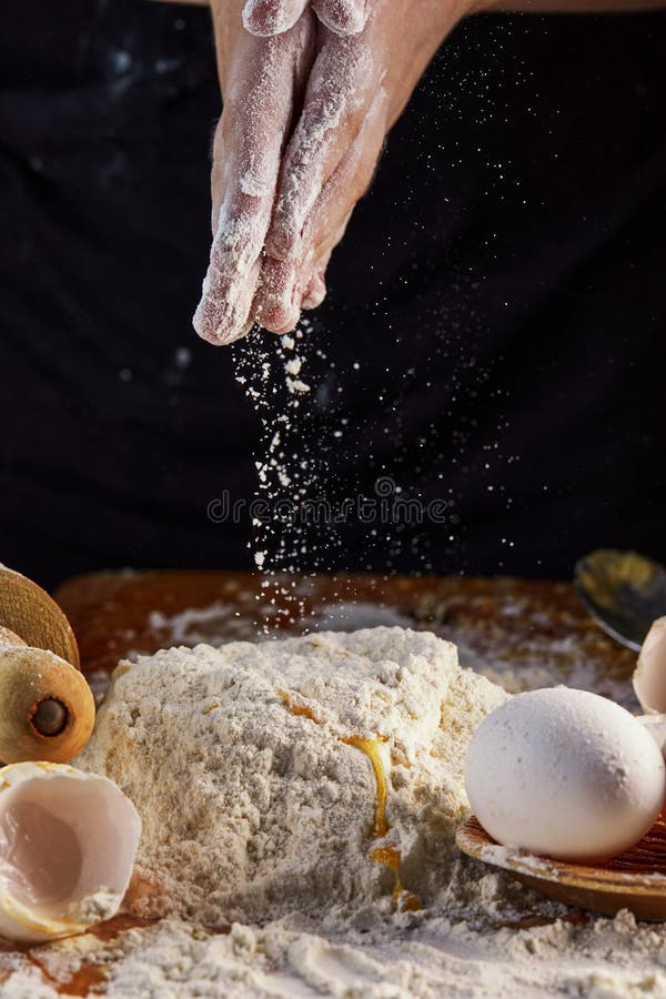 Female Hands Adding Flour To Dough, Kneading Dough for Baking. Flour in ...