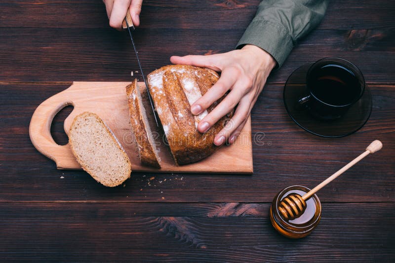 Female Hands Cut Bread on the Table Stock Image - Image of honey, baked ...
