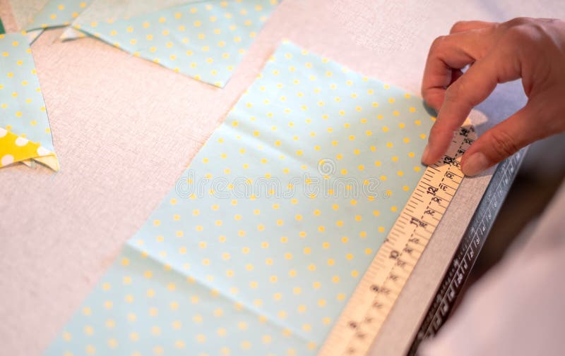 Female Hands of Designer at Work with Fabric Close-up. Tailor Measuring ...