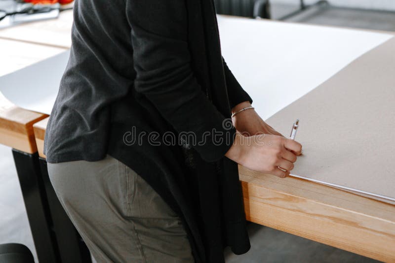 Female Hands are Drawing on a Large Wooden Table in the Loft Style in ...