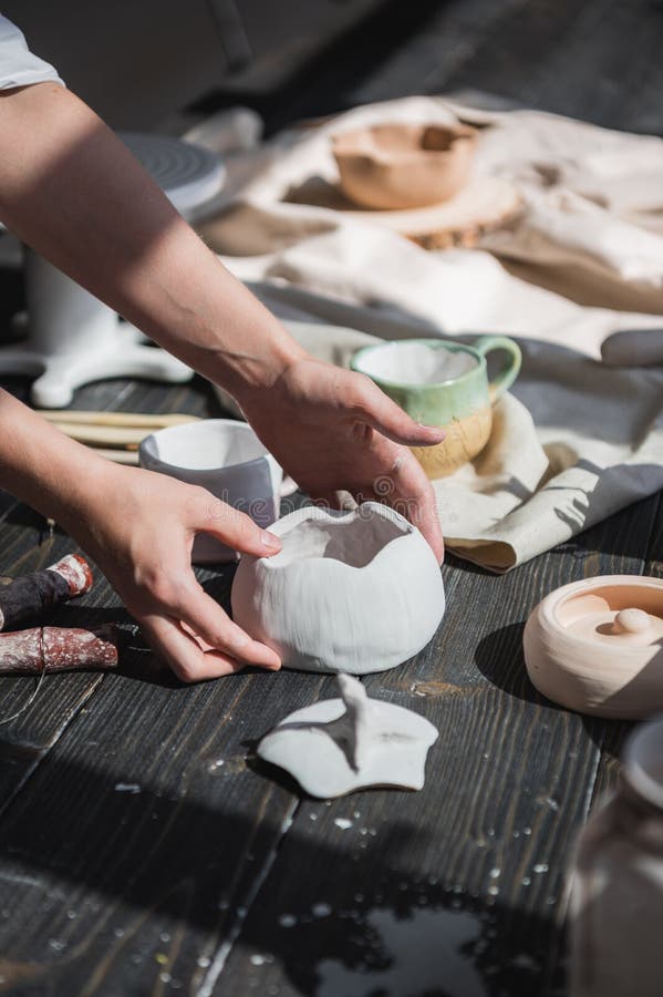 Female Hands Gently Putting the Finished Glazed Bowl on a Wooden Table ...