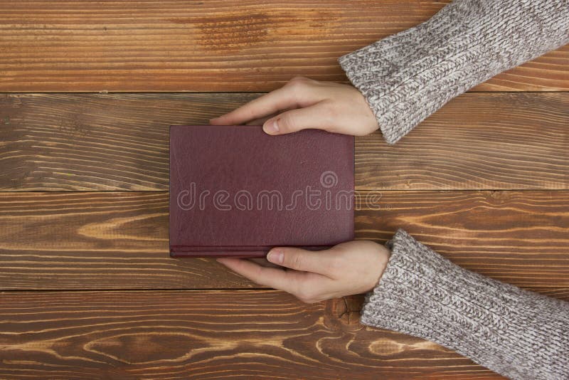 Female Hands Hold a Blank Empty Book or Note, Diary Cover on the Wood ...