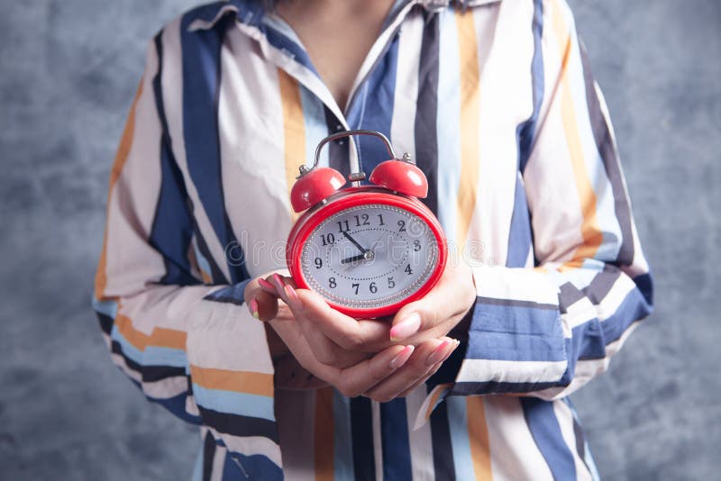 Female Hands Holding an Alarm Clock Stock Image - Image of holding ...