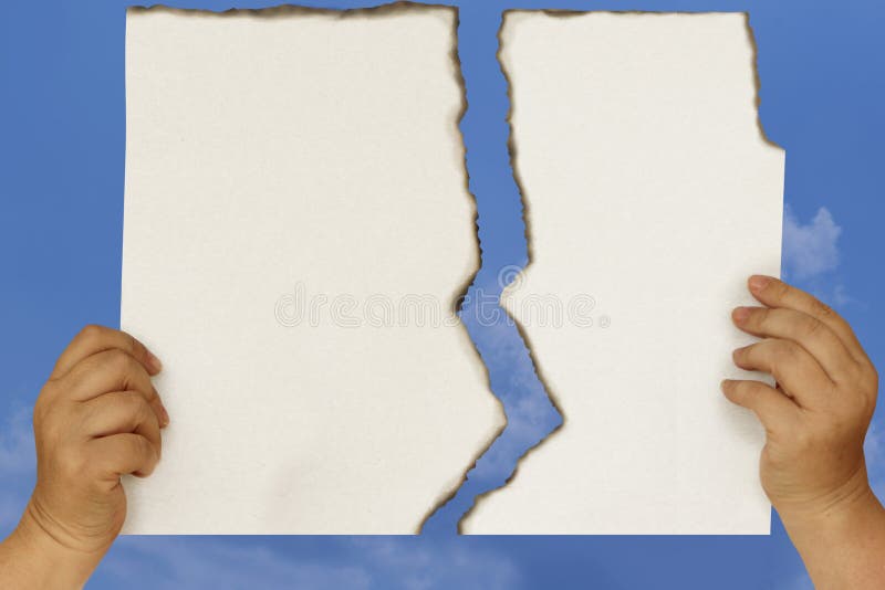 Female Hands are Holding on a Blue Sky Background Torn in Two on an ...