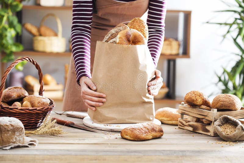 Female Hands Holding Bread Packet Stock Photo - Image of brown, loaf ...