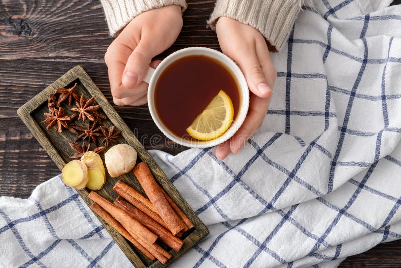 Female Hands Holding Cup of Tea with Lemon on Wooden Table Stock Photo ...