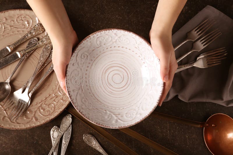 Female hands holding dish stock photo. Image of dish - 116581942