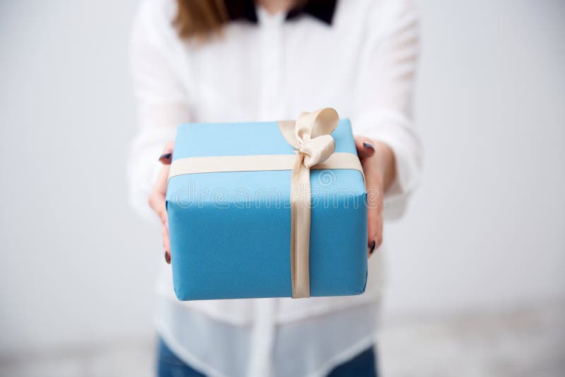 Female hands holding gift stock image. Image of giving - 49691323