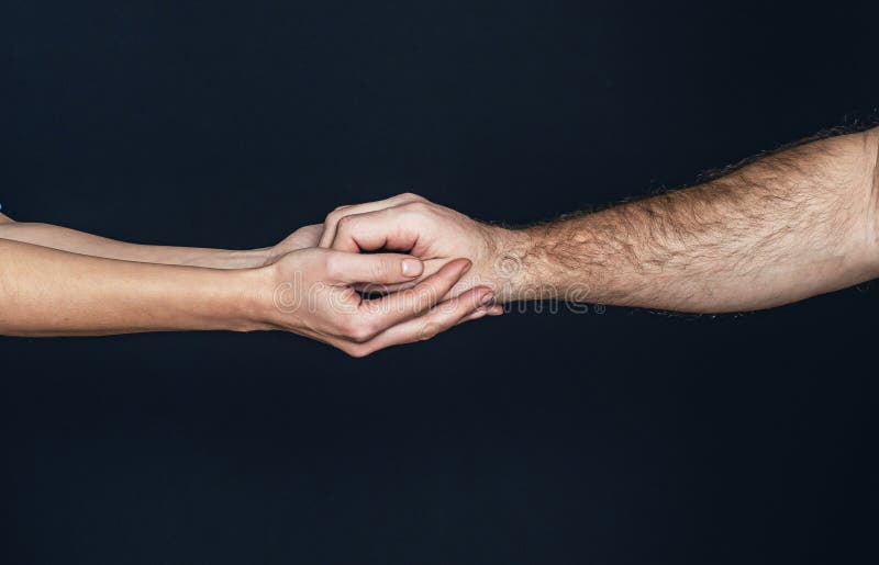 Female Hands Holding Male Hand Gently, Support on Black Background ...
