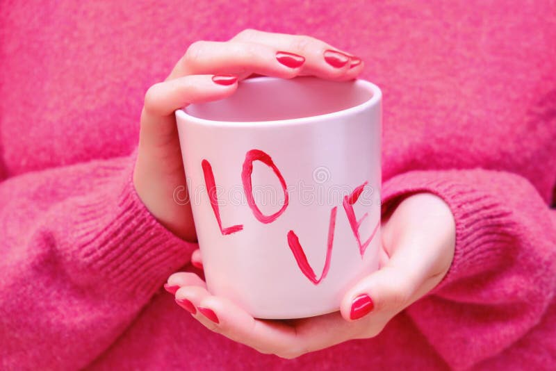 Female Hands Holding a Pink Cup with the Inscription Love Stock Photo ...
