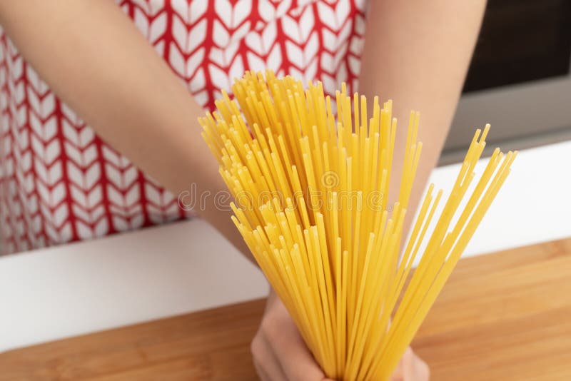 Female Hands Holding Spaghetti in the Kitchen Stock Photo - Image of ...