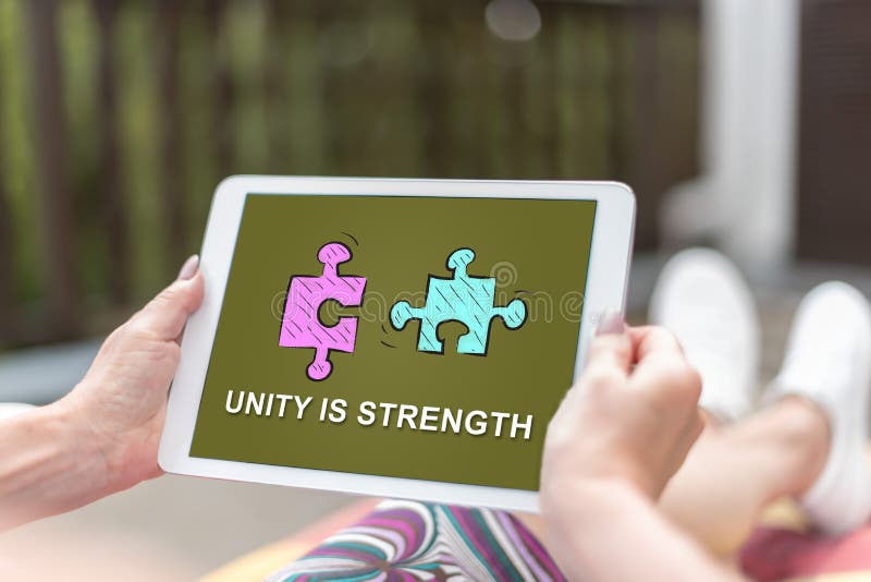 Unity concept on a tablet stock image. Image of jigsaw - 100838003