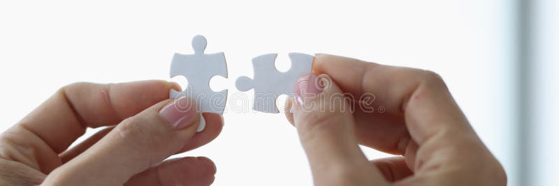 Female Hands Holding Two White Puzzle Pieces Closeup Stock Photo ...