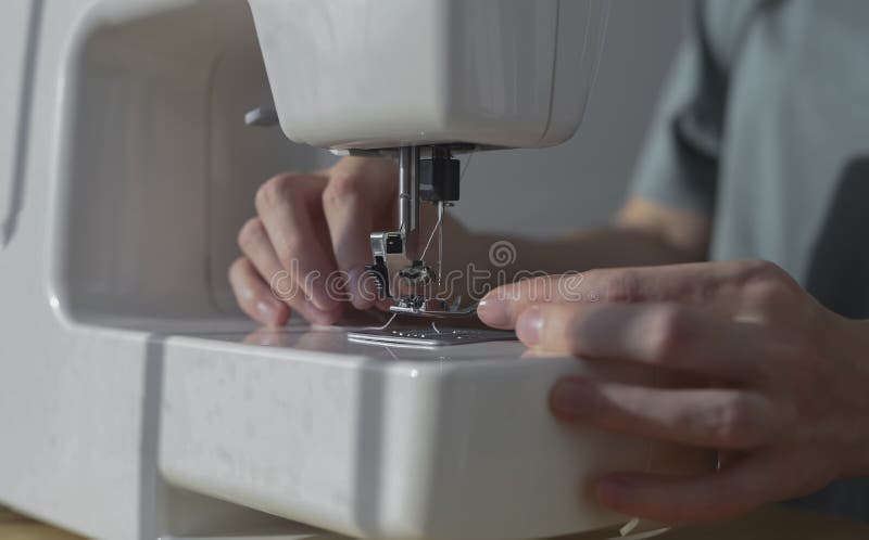 Female Hands Inserting Thread through Needle Hole in Sewing Machine ...
