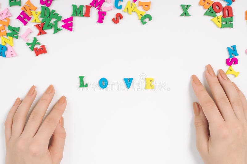 Female Hands Lay Out the Word Love from Letters Stock Photo - Image of ...