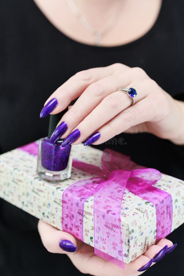 Female Hands with Long Nails Hold a Gift Box Stock Image - Image of ...