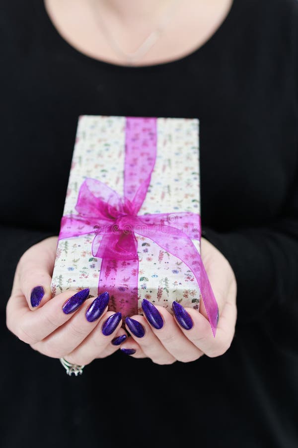 Female Hands with Long Nails Hold a Gift Box Stock Image - Image of ...